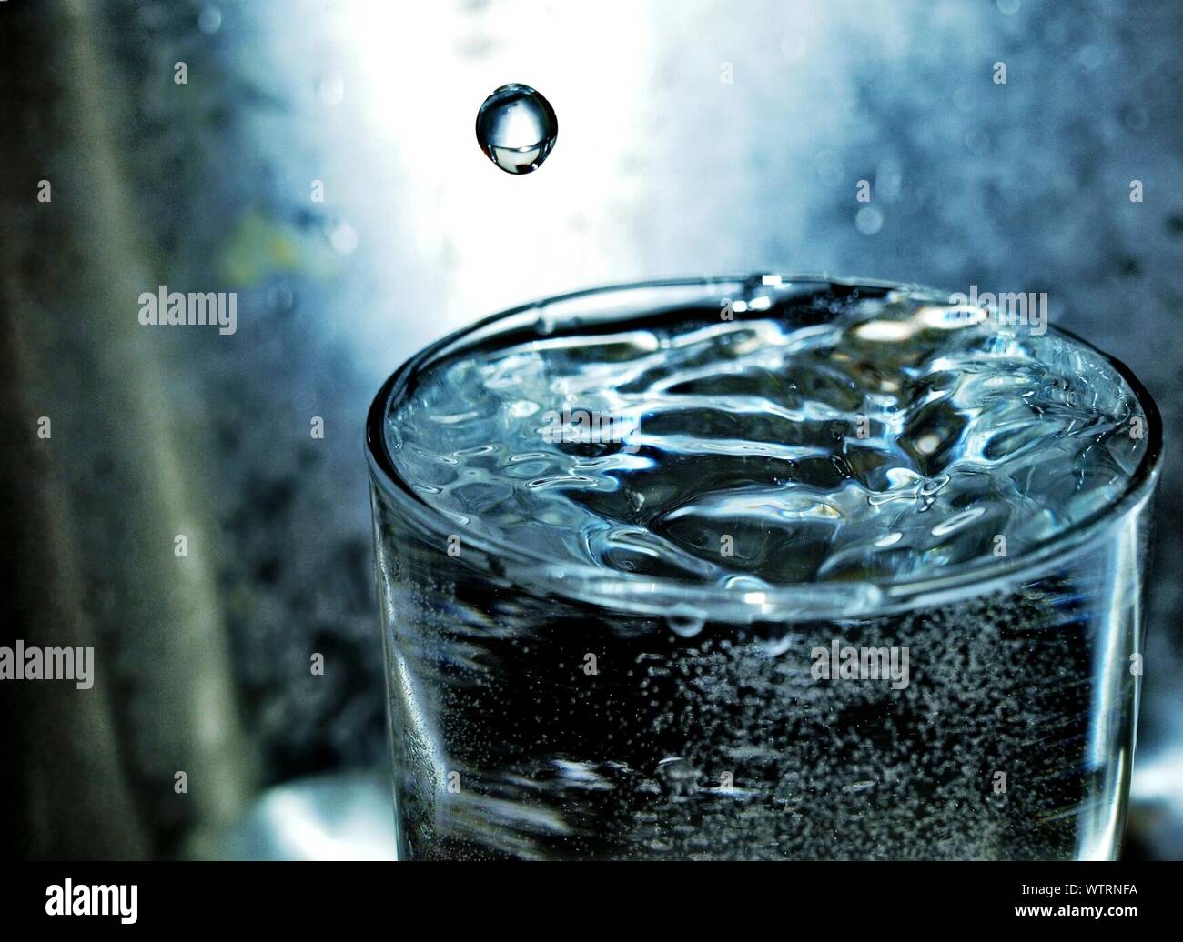 Water drop falling on water hi-res stock photography and images - Alamy