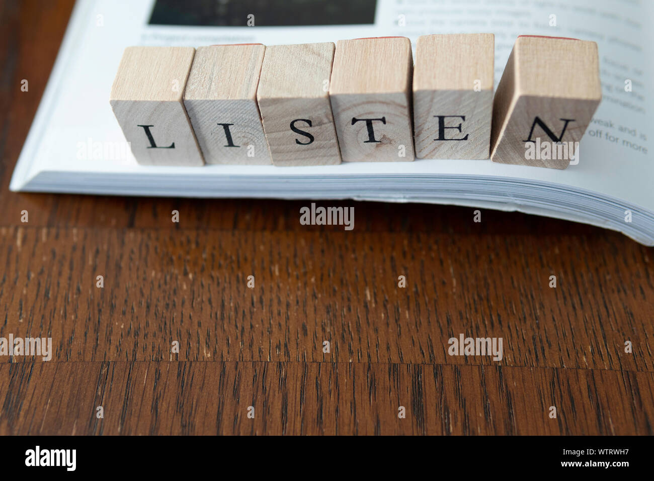LISTEN in Block Letter on an open book - Listening to an Audio book ...