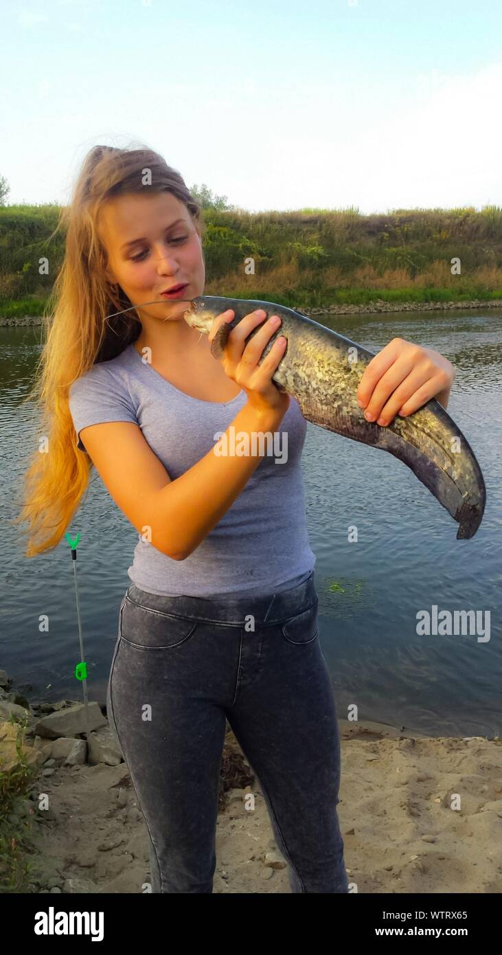 Woman with fish hi-res stock photography and images - Alamy