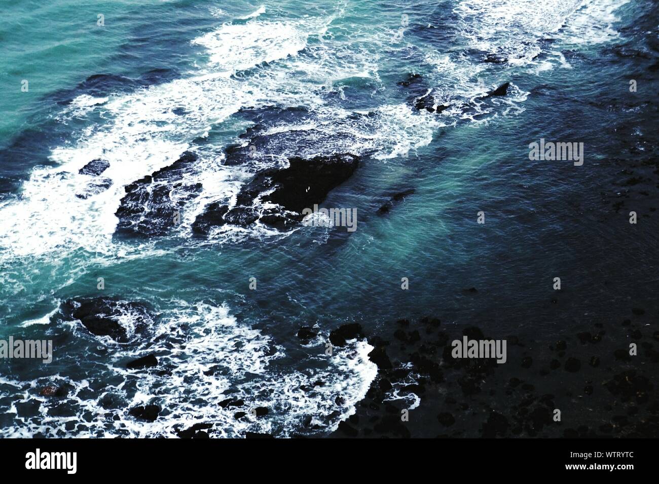 Aerial waves rocks hi-res stock photography and images - Alamy