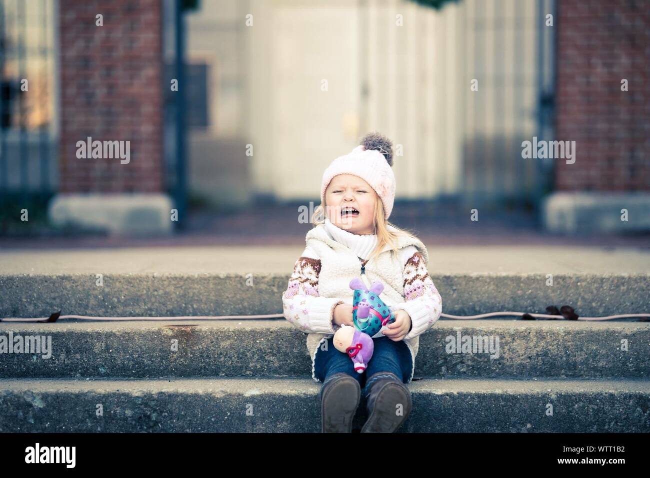 Child crying with toy hi-res stock photography and images - Alamy