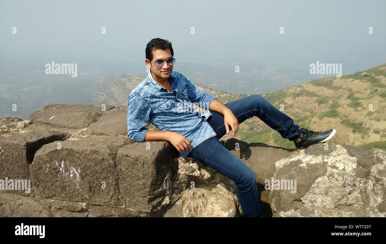 Indian man on rocks hi-res stock photography and images - Alamy