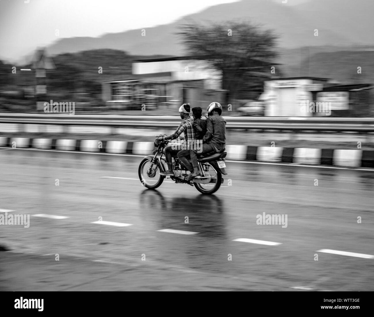 Three men riding hi-res stock photography and images - Alamy