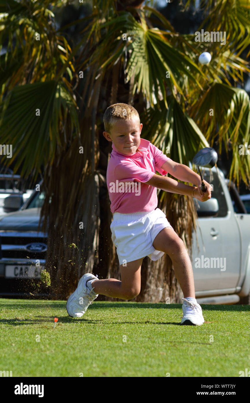 Young kid playing golf Stock Photo - Alamy
