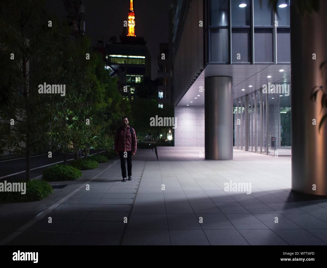 Man walking into a building hi-res stock photography and images - Alamy