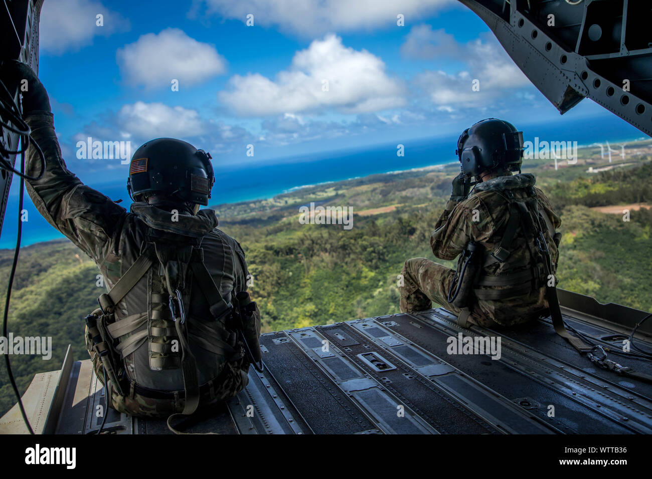 Soldiers of 25th Infantry Division enjoy a view during a ride over the ...