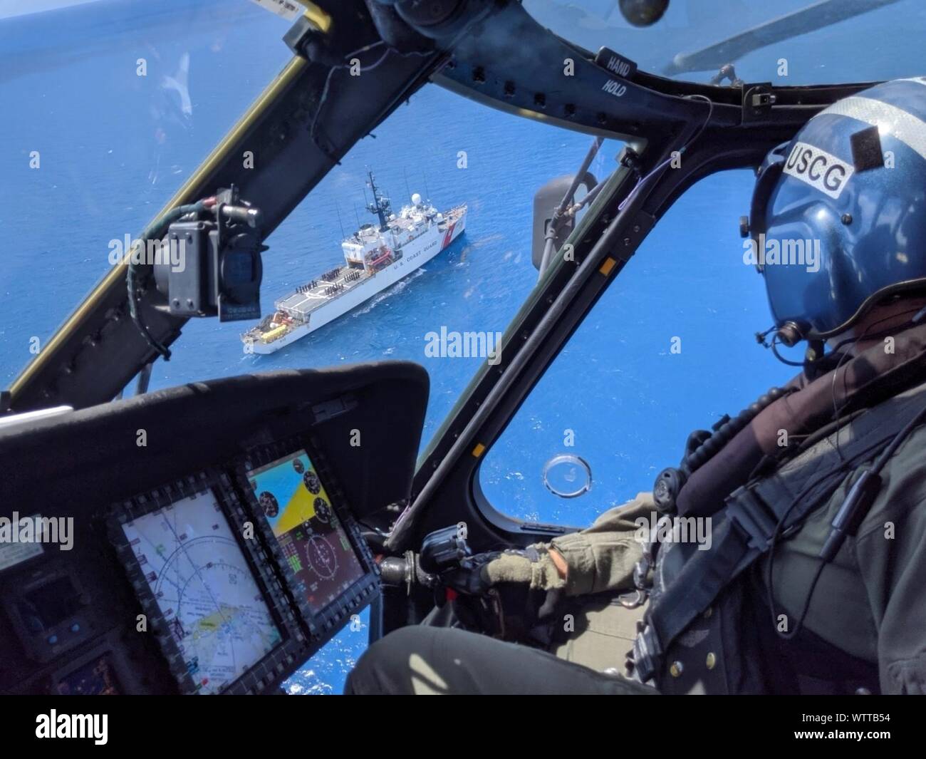 A Coast Guard Air Station Clearwater MH-60 Jayhawk helicopter crew and ...