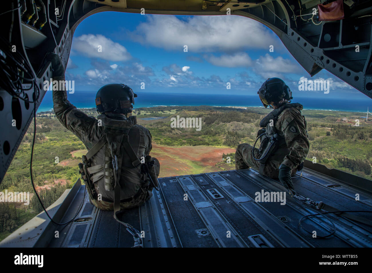 Soldiers of 25th Infantry Division enjoy a view during a ride over the ...