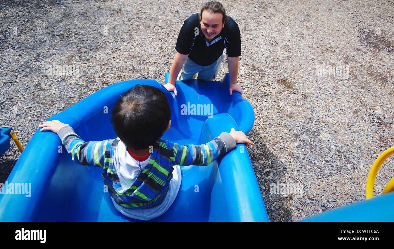 Father and son in playground hi-res stock photography and images - Alamy