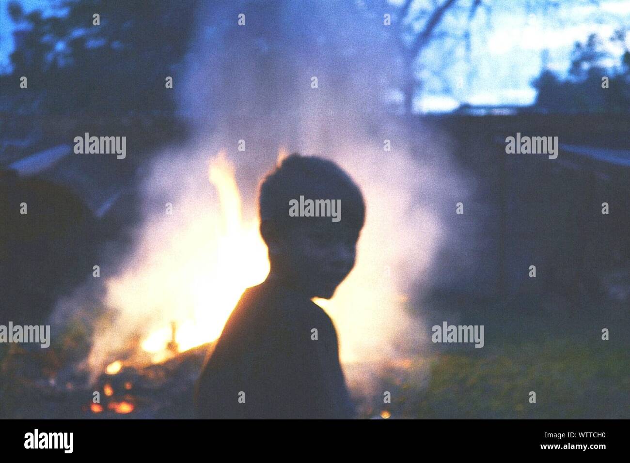 Portrait Of Boy Against Bonfire Stock Photo - Alamy