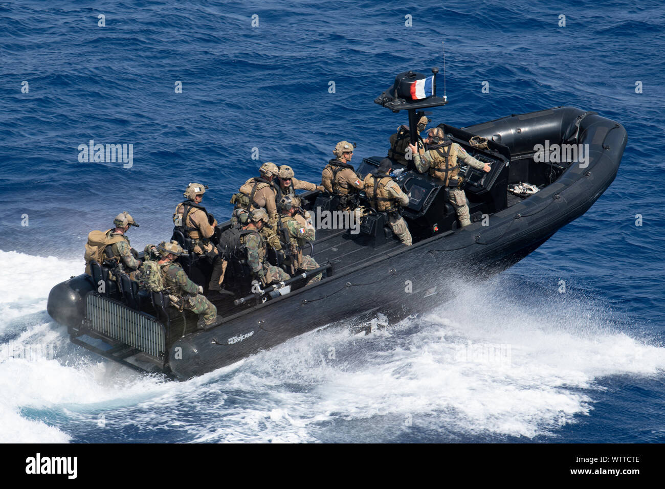 Zodiac boats move a multinational joint Special Operations Task Force ...