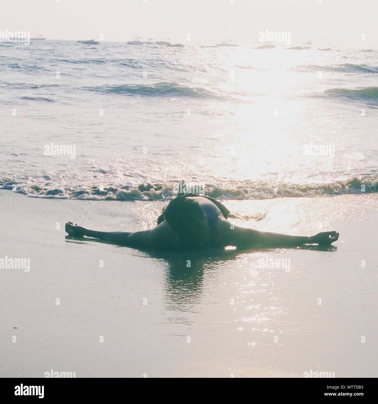 Man lying down in the sea hi-res stock photography and images - Alamy