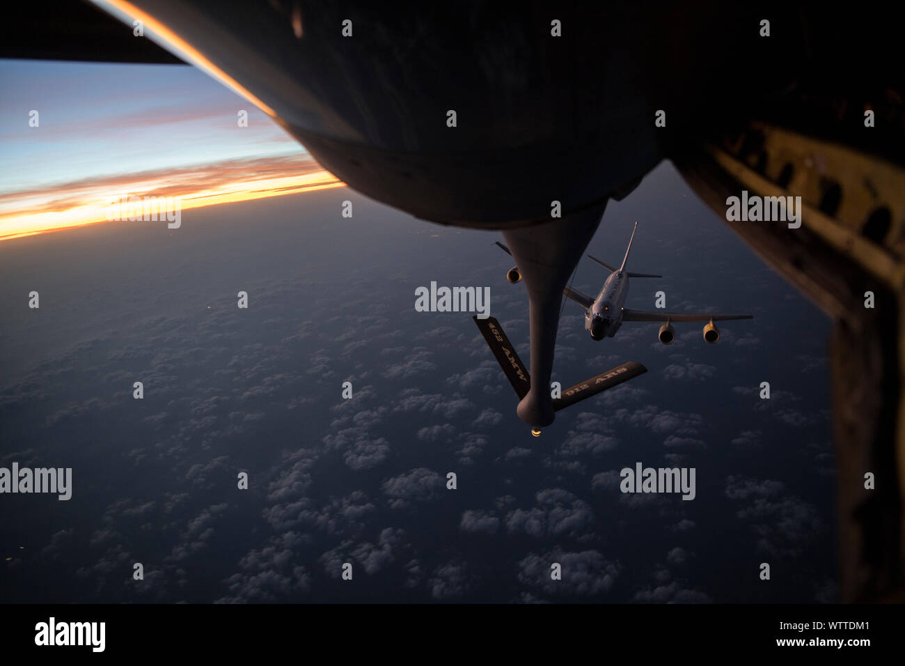 A U.S. Air Force RC-135 Rivet Joint approaches the boom of a 28th ...