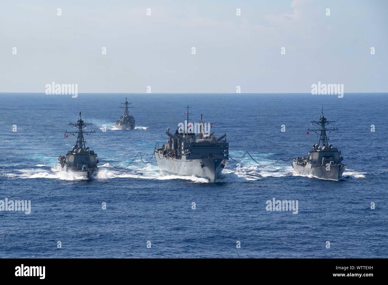 The guided-missile destroyer USS Forrest Sherman (DDG 98), left, the ...