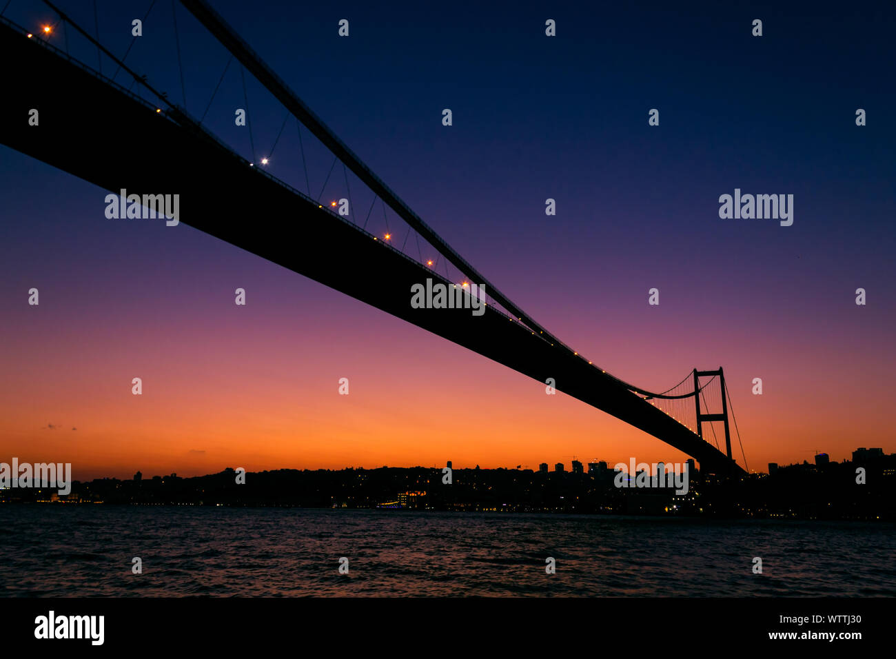 Colorful sunset above Bosporus Bridge in Istanbul, Turkey Stock Photo ...