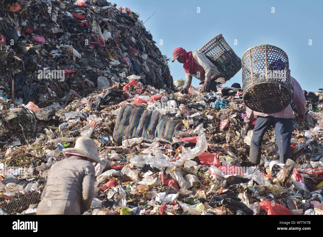 Bekasi, Indonesia. 11th Sep, 2019. Scavengers sort and collect plastics ...