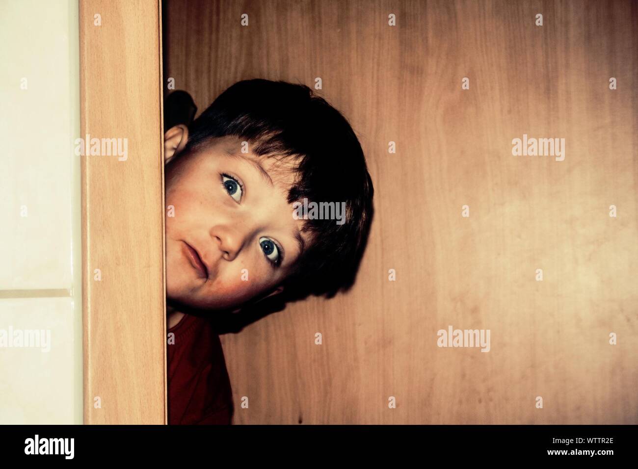 Peeking Through Door High Resolution Stock Photography and Images - Alamy
