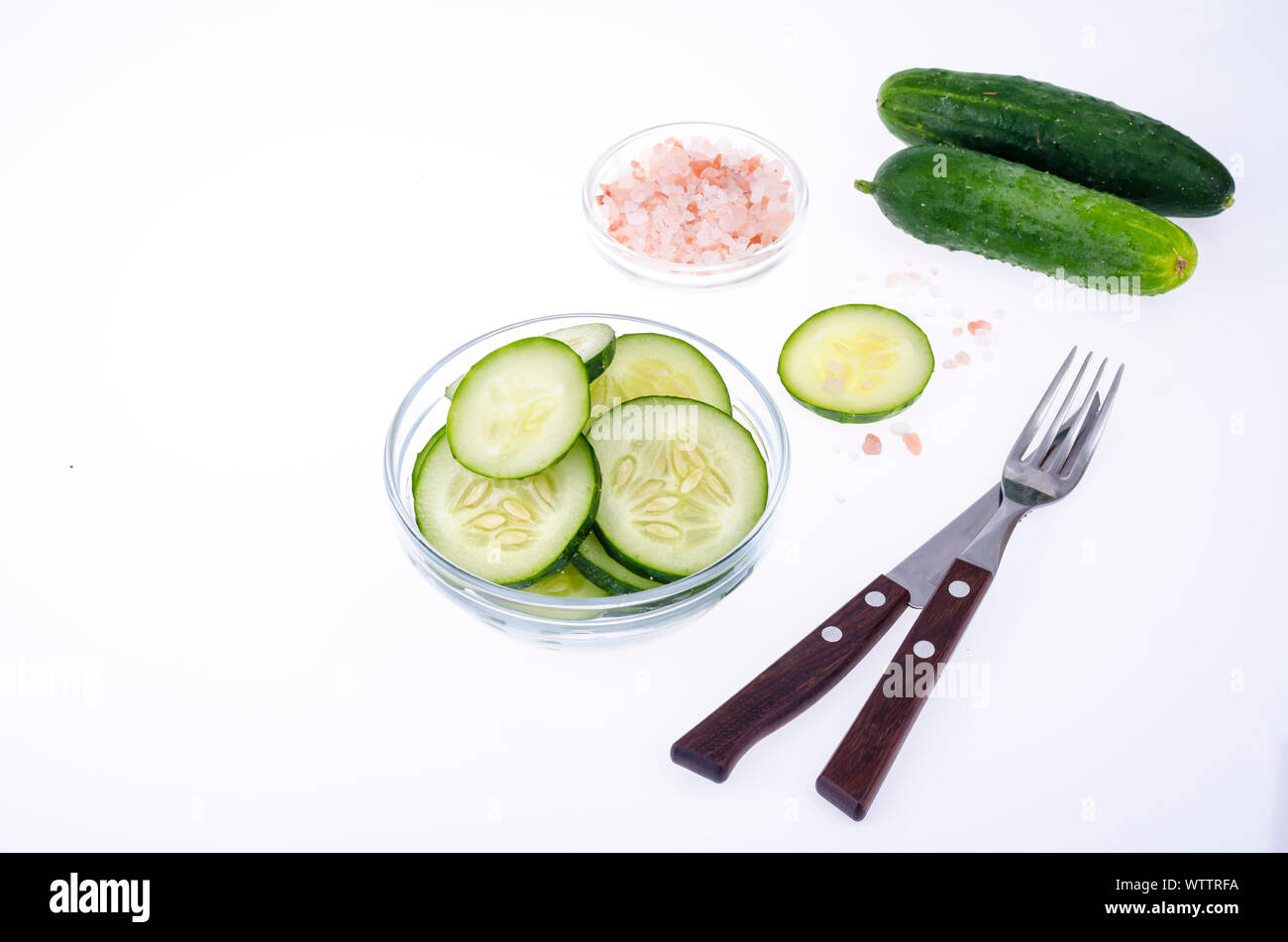 Slices of fresh cucumber in glass bowl Stock Photo - Alamy