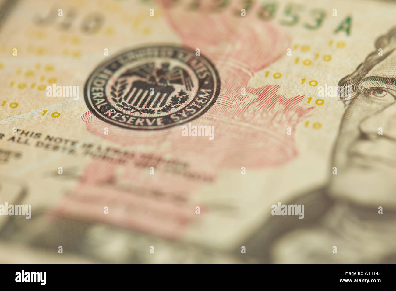 Stamp of federal reserved system on ten dollar banknote close up view ...