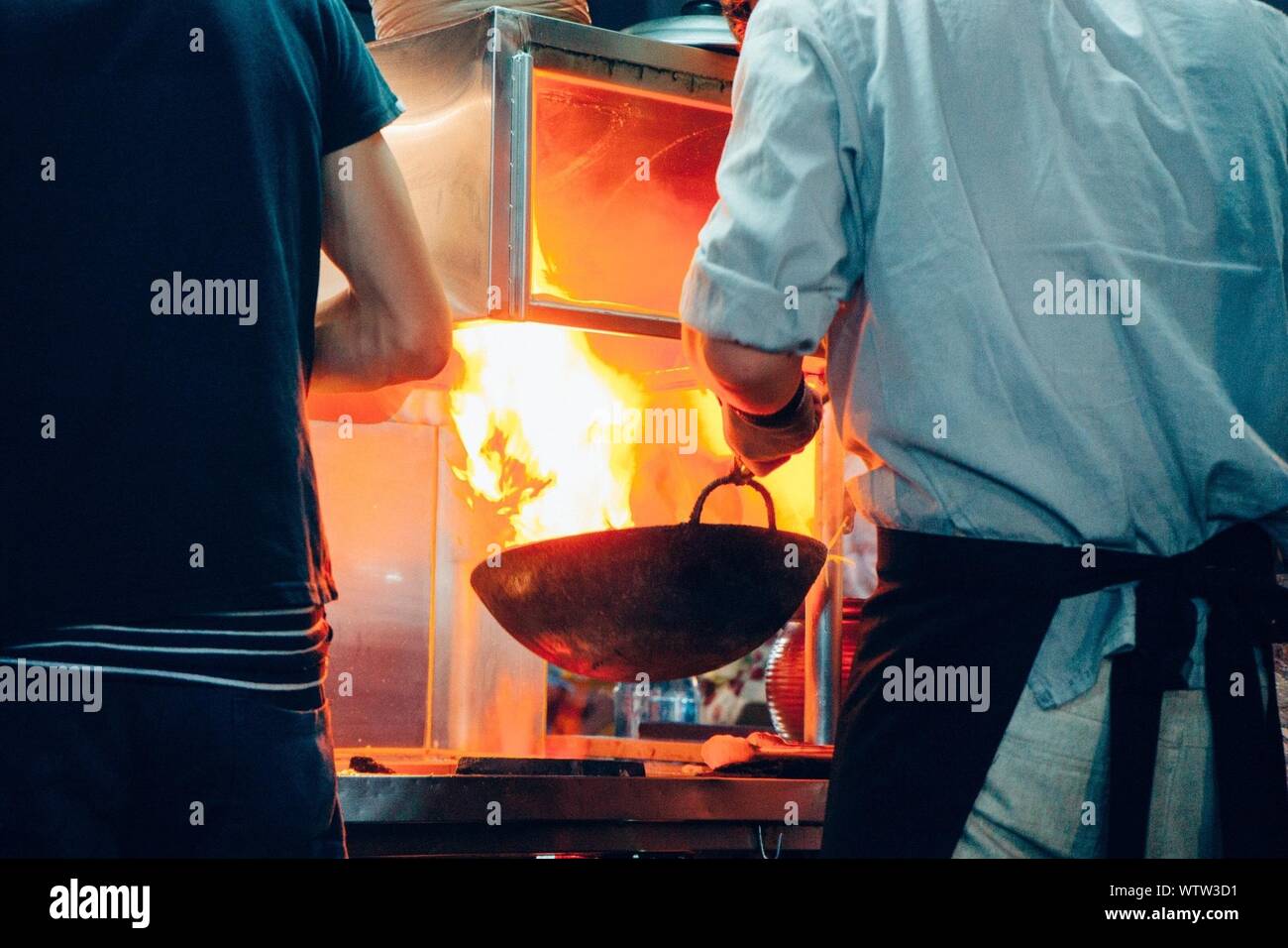 Chef working flaming pan hi-res stock photography and images - Alamy