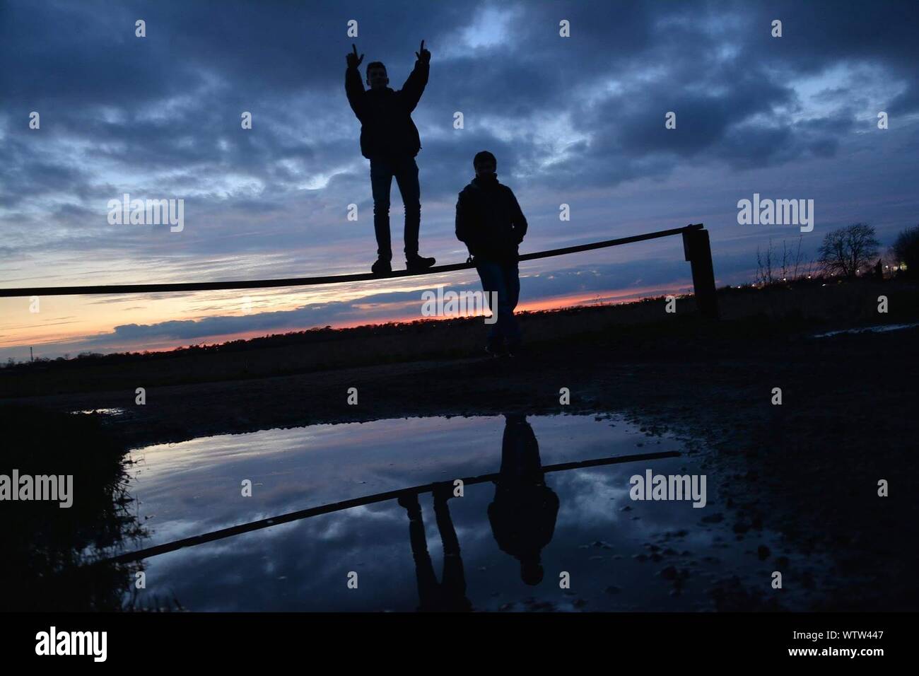 Silhouette railing sky sunset black color hi-res stock photography and ...