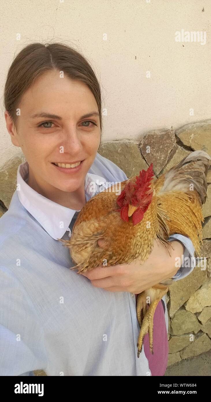 Person holding rooster hi-res stock photography and images - Alamy