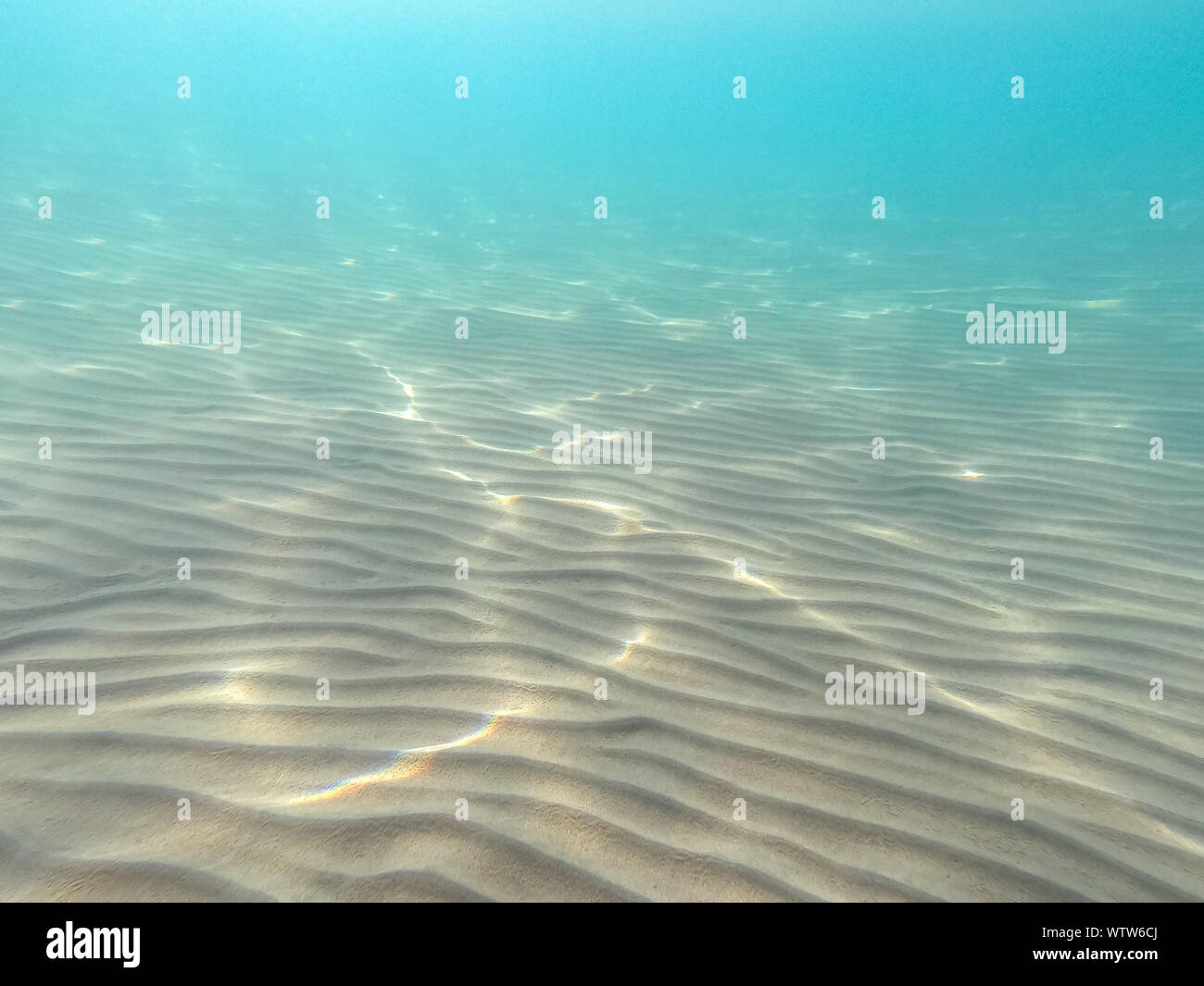 Clear water. underwater background with sandy sea bottom Stock Photo ...