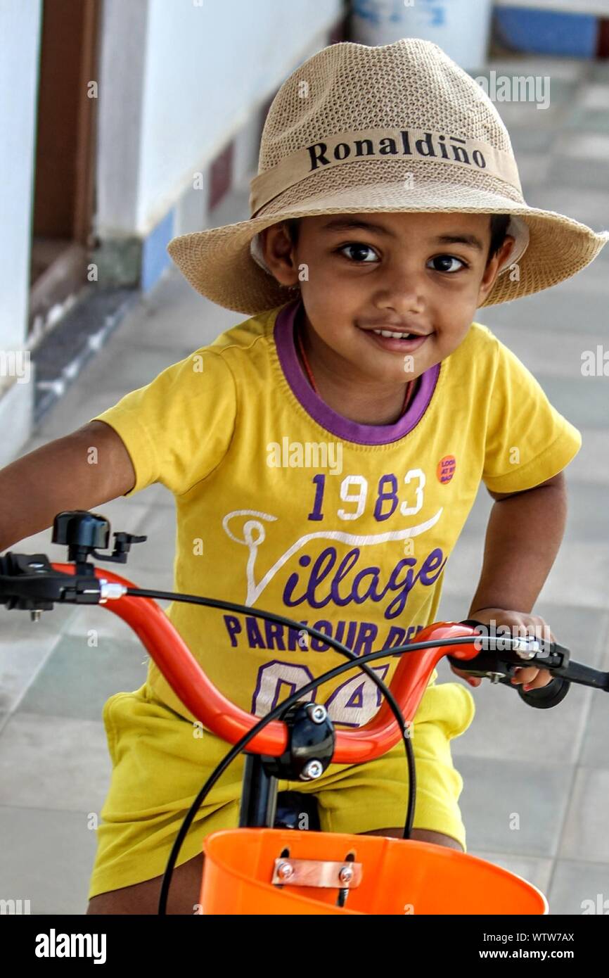 Indian boy riding bicycle on hi-res stock photography and images - Alamy