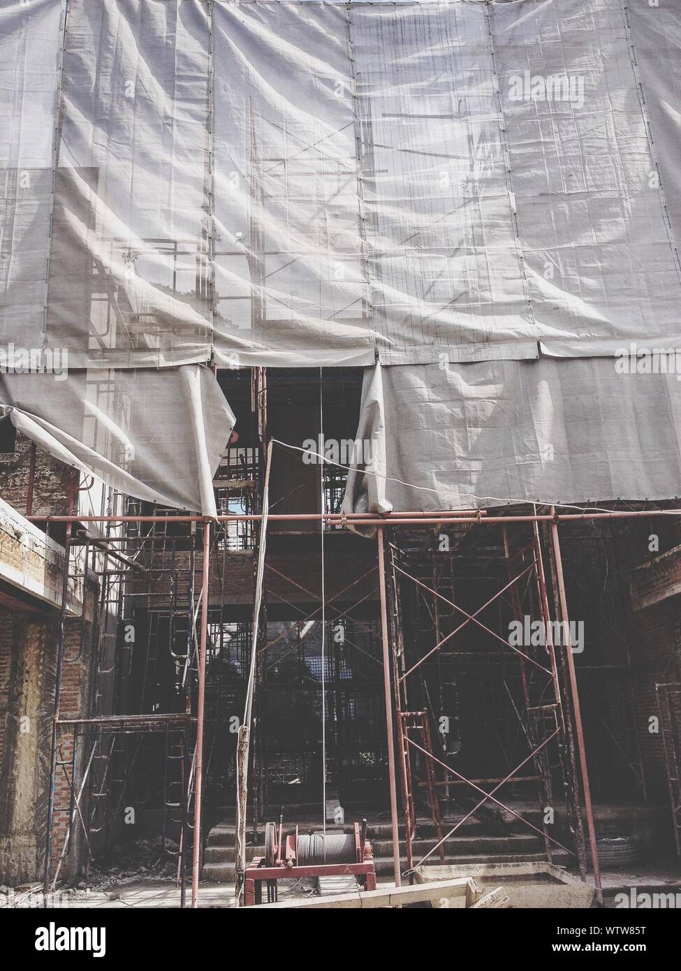 Under construction building covered fabric hi-res stock photography and ...
