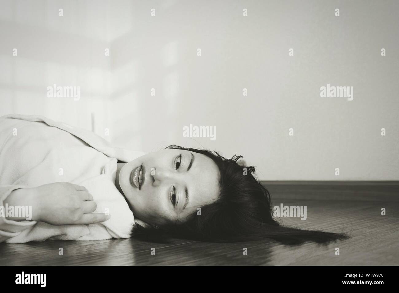 Woman lying floor hi-res stock photography and images - Alamy