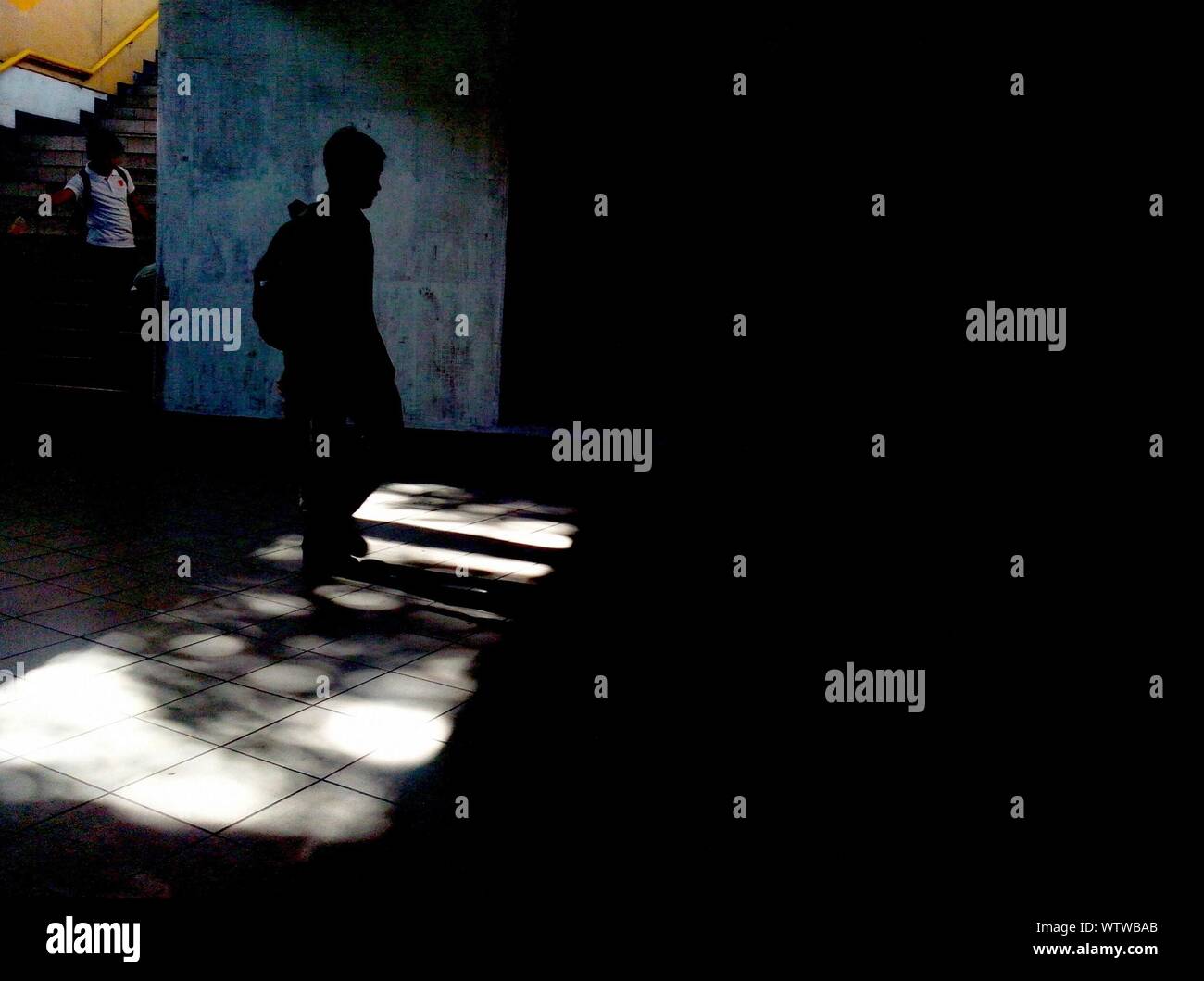 Silhouette Man Outside Building Stock Photo - Alamy