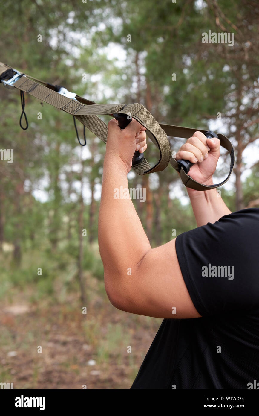 Man hanging by one arm hi-res stock photography and images - Alamy