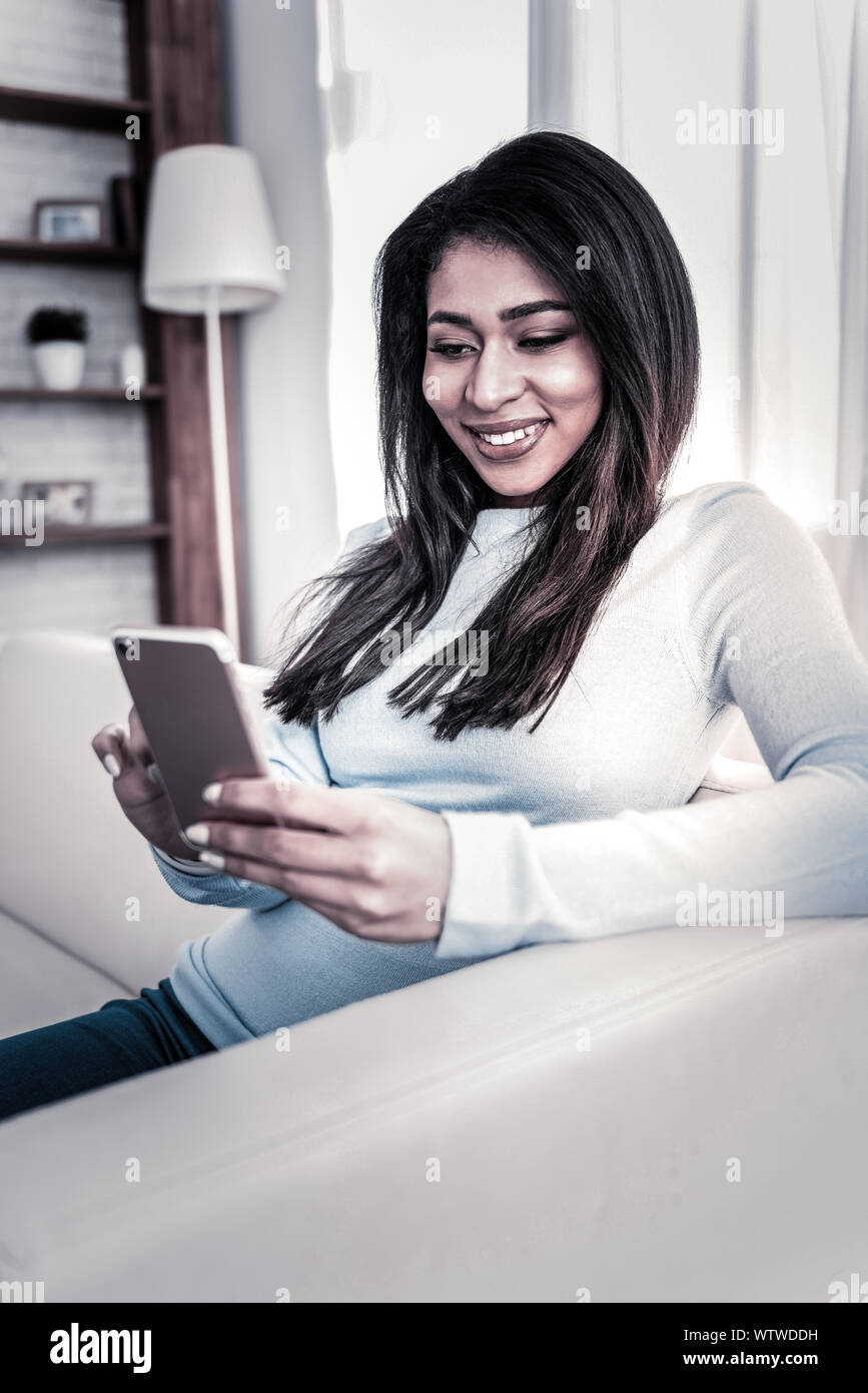 Attractive African American girl playing with her mobile phone Stock ...