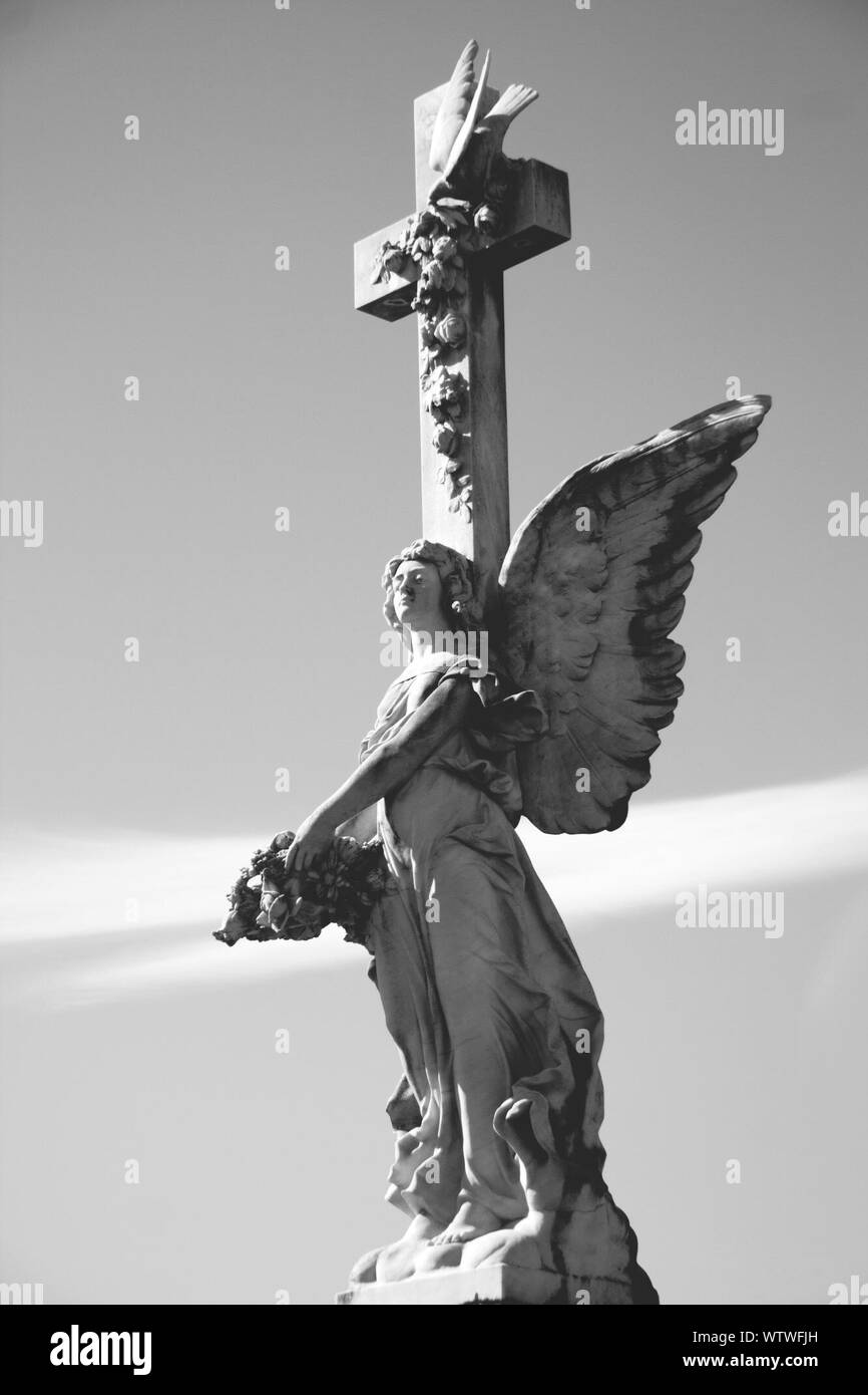 Angel on cross hi-res stock photography and images - Alamy