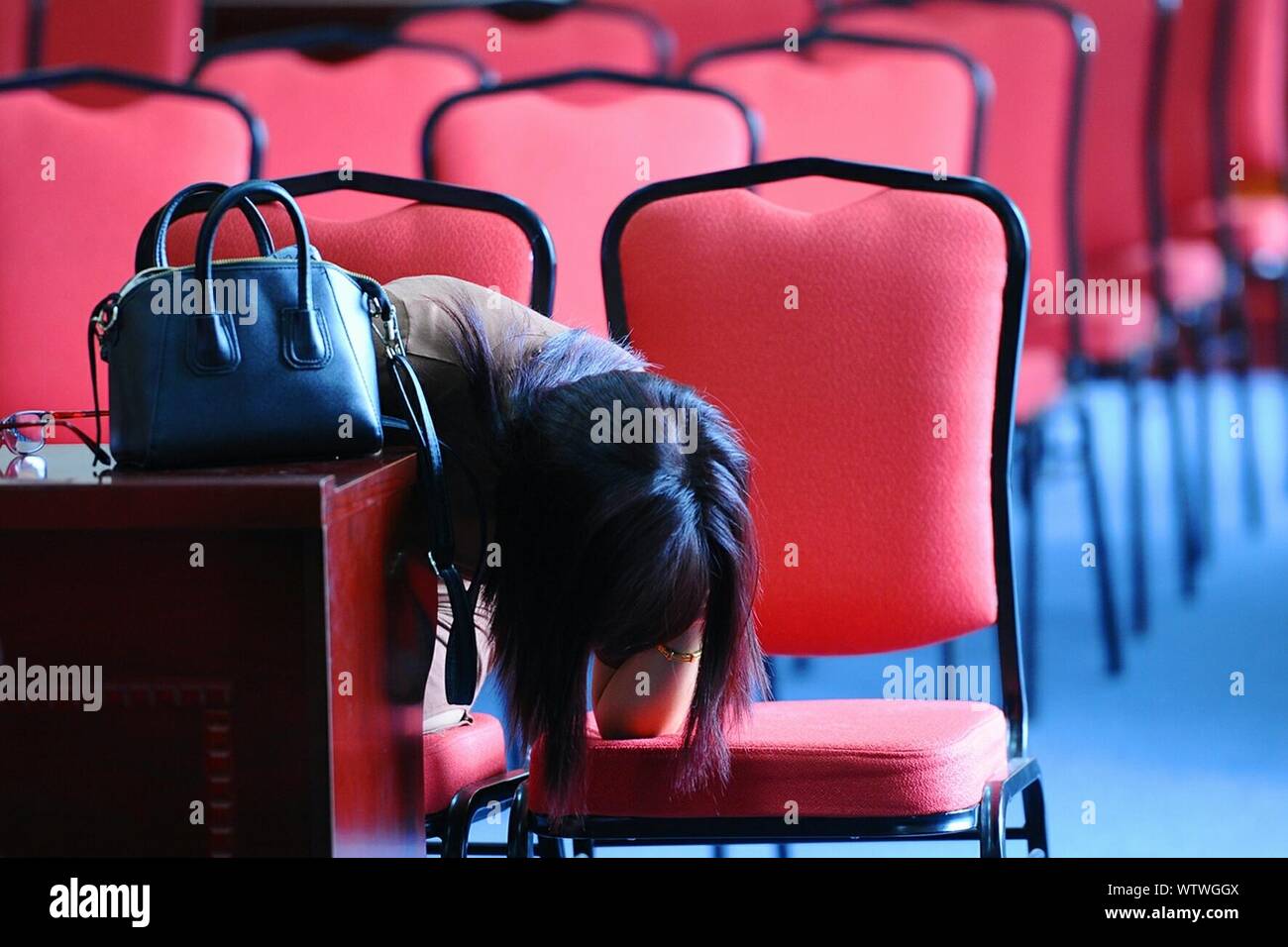 Woman bending over table hi-res stock photography and images - Alamy