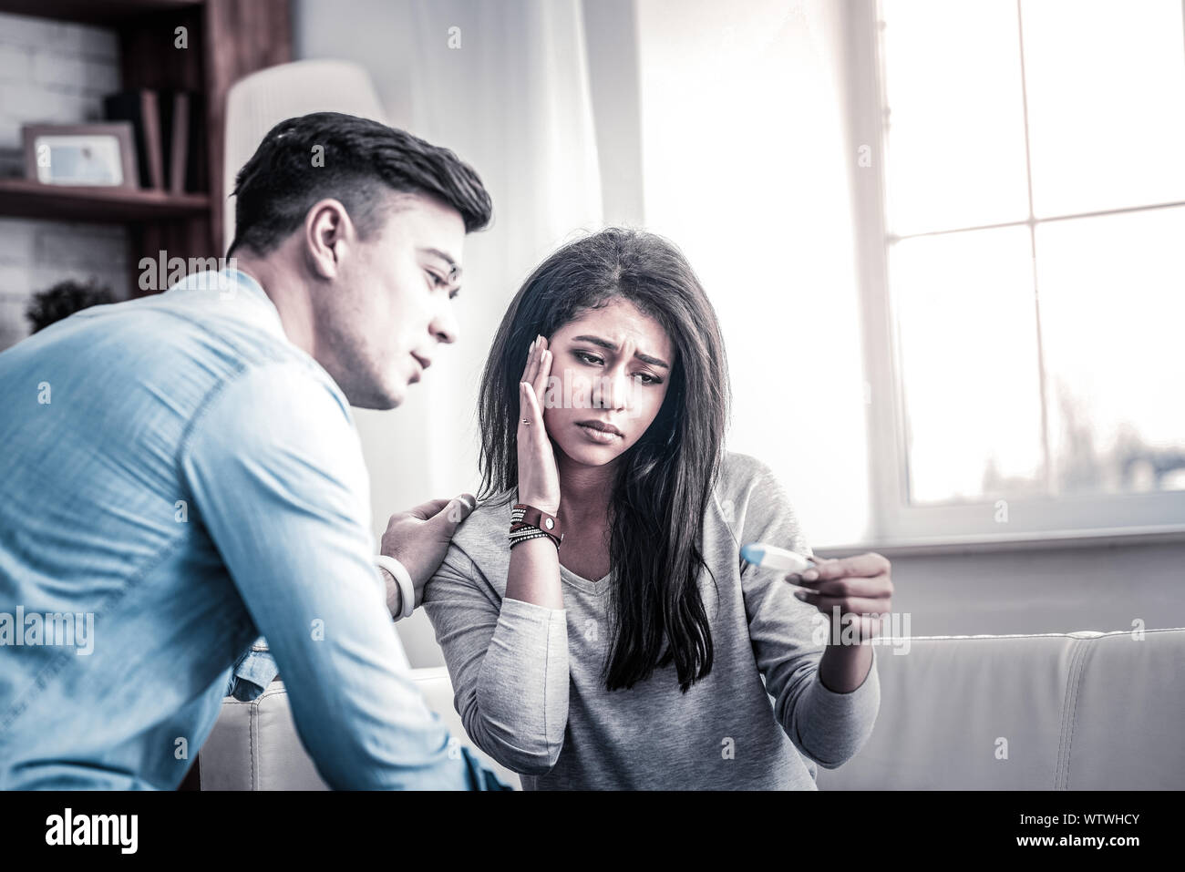 Exhausted lady being afraid of her high temperature Stock Photo - Alamy