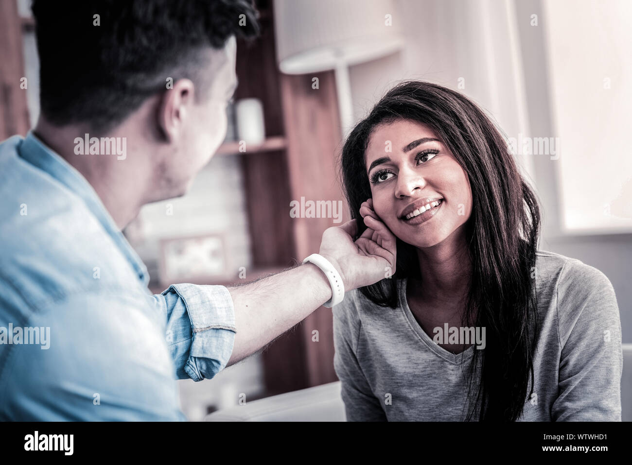 Thoughtful husband gently touching face of his wife Stock Photo - Alamy