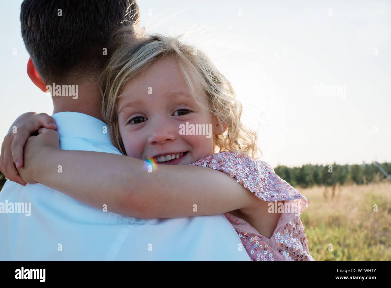 Child Being Carried By A Man High Resolution Stock Photography and ...