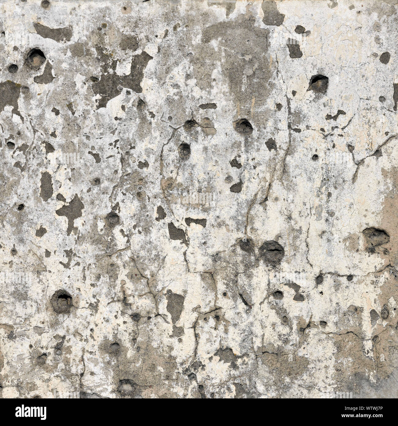 Concrete wall background with bullet holes, potholes from weapon ...