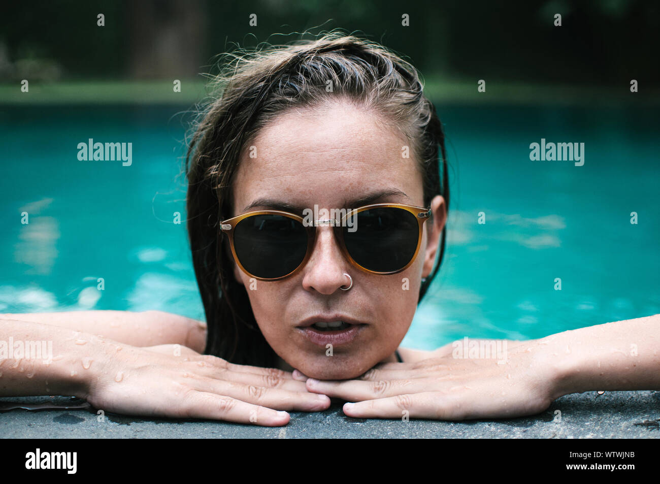 Young Woman In Swimming Pool Stock Photo - Alamy