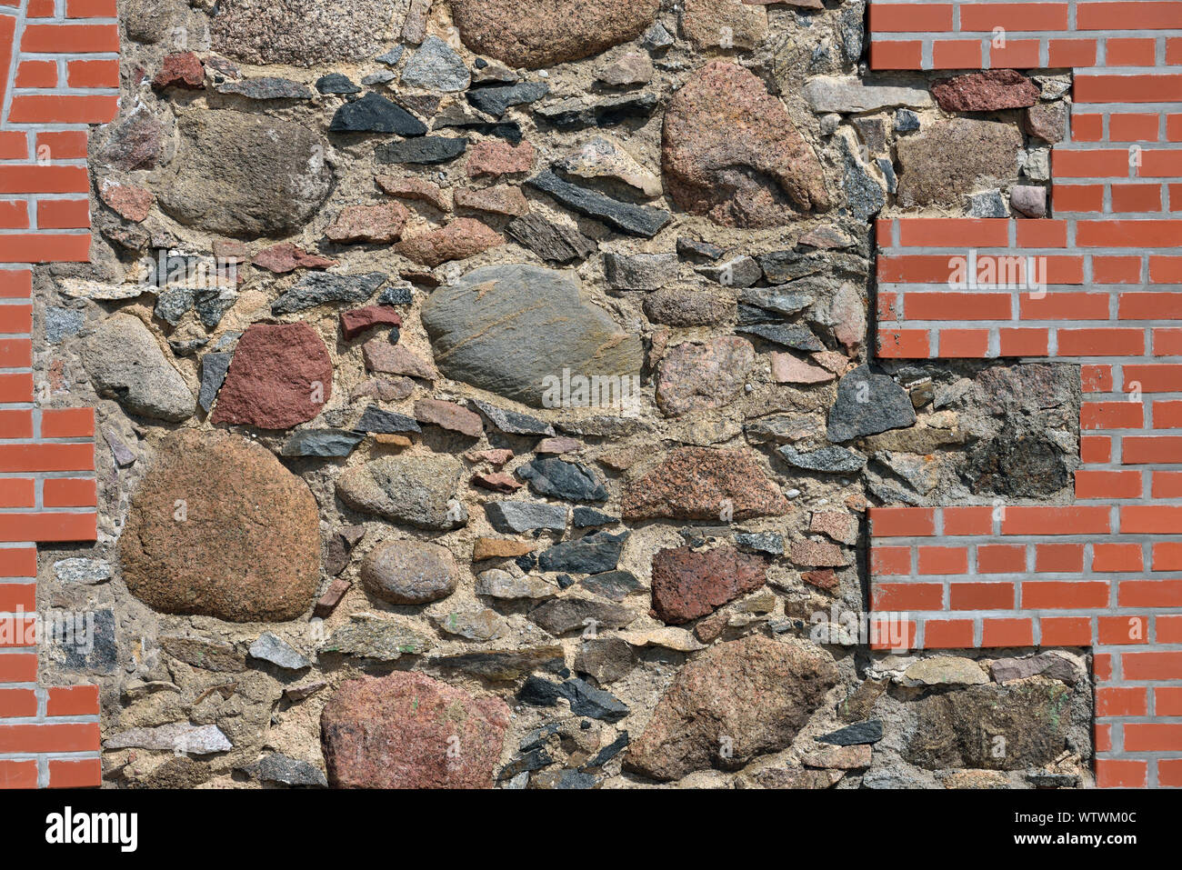 Stones and red bricks wall, architecture background Stock Photo - Alamy