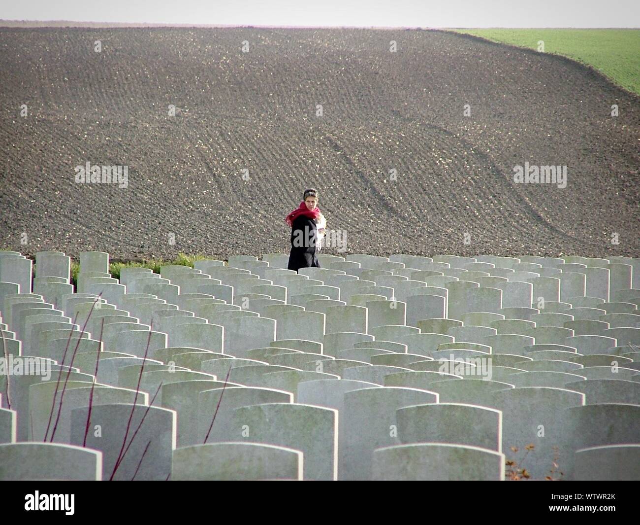 Woman Standing Grave In Cemetery High Resolution Stock Photography and ...