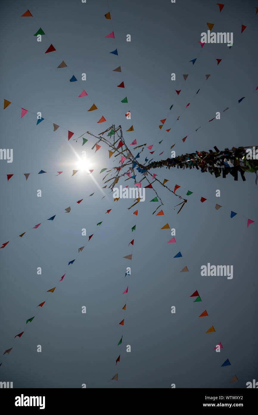 Multi-color triangle pray flags at Thai celebration festival with cloud ...