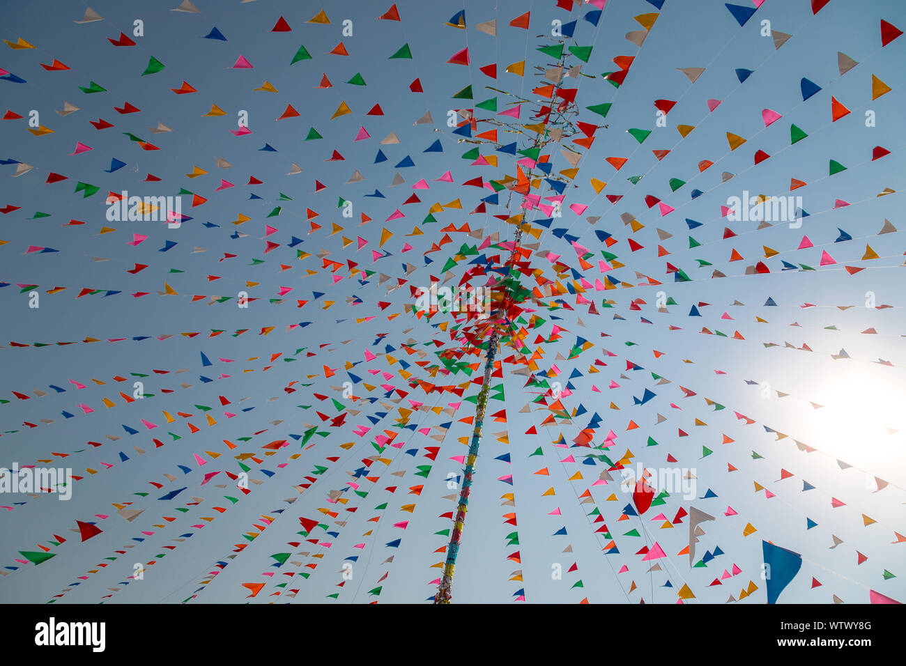 Multi-color triangle pray flags at Thai celebration festival with cloud ...