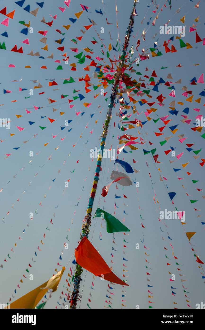 Multi-color triangle pray flags at Thai celebration festival with cloud ...