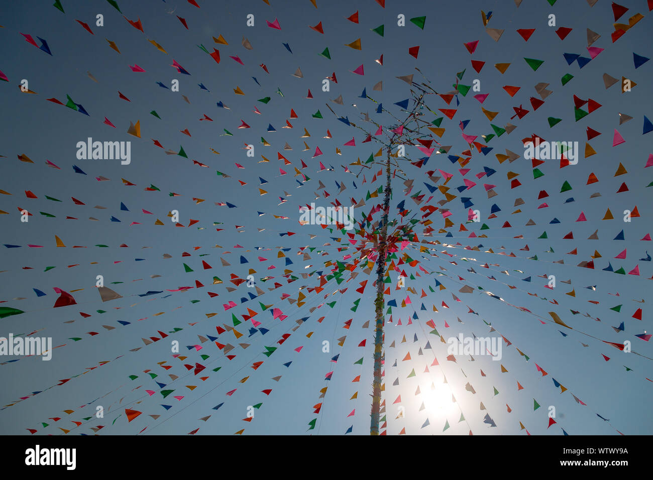 Multi-color triangle pray flags at Thai celebration festival with cloud ...