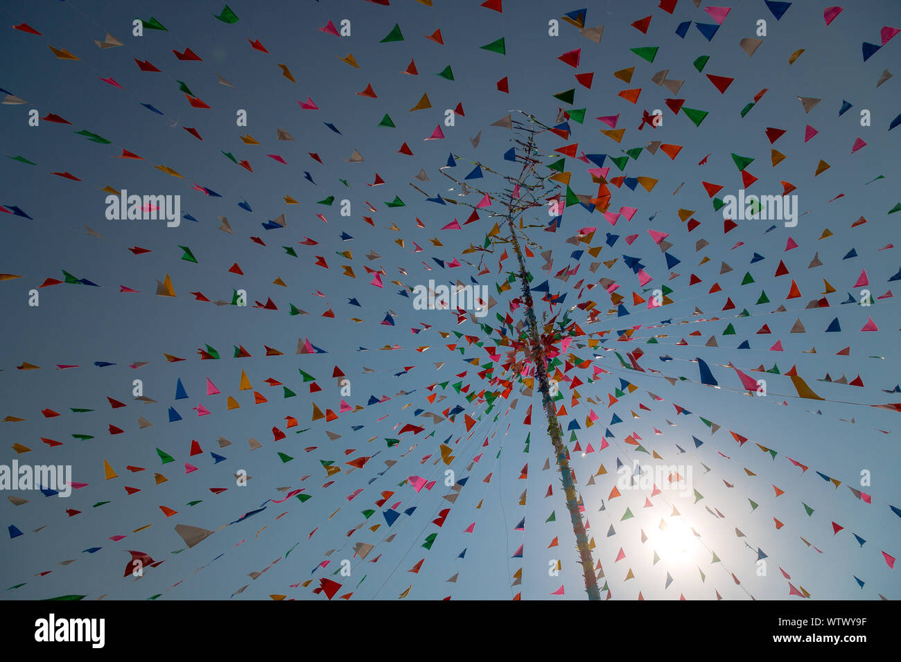 Multi-color triangle pray flags at Thai celebration festival with cloud ...