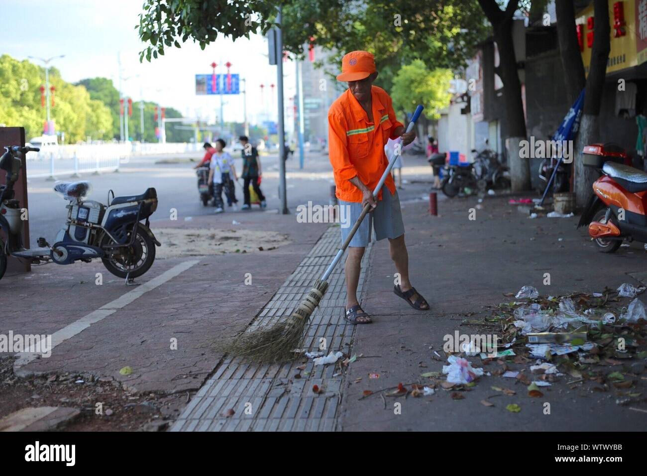 Worker sweeping hi-res stock photography and images - Alamy