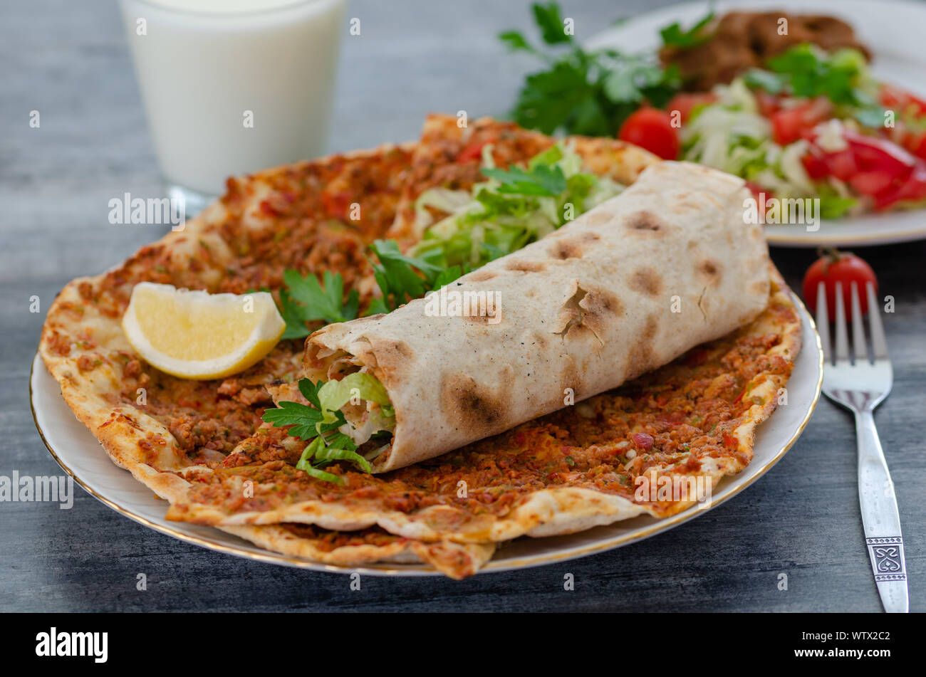 Traditional delicious Turkish food; Turkish Lahmacun ready for meal ...
