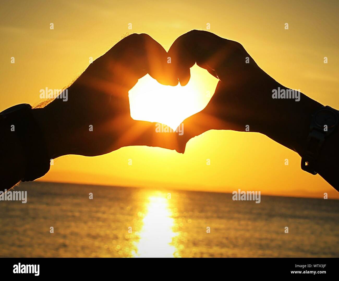 Hands Making A Heart In The Sky
